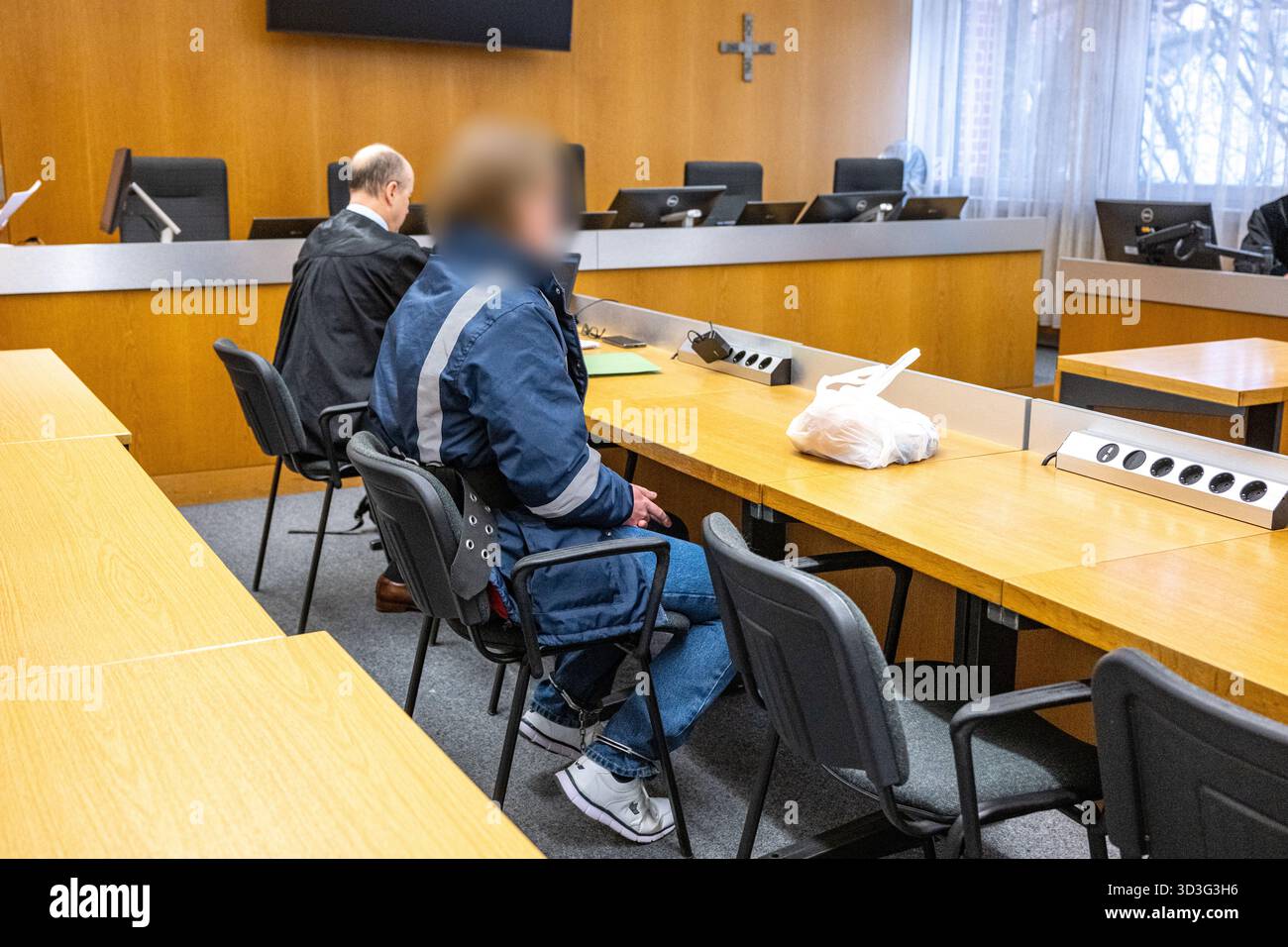 06 November 2025, Bavaria, Landshut: The defendant (r) sits in the ...