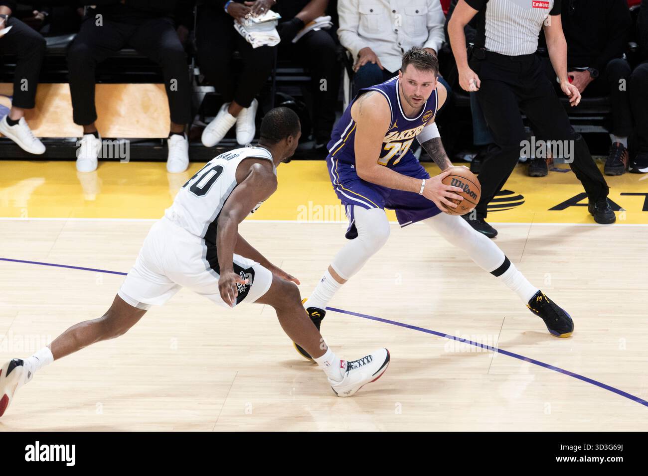 Los Angeles Lakers’ Luka Don?i? (77) is defended by San Antonio Spurs ...