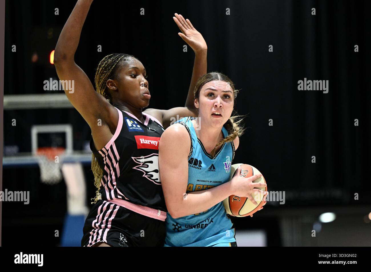 Agnes Emma-Nnopu of the Flames and Teige Morrell of the Capitals during ...