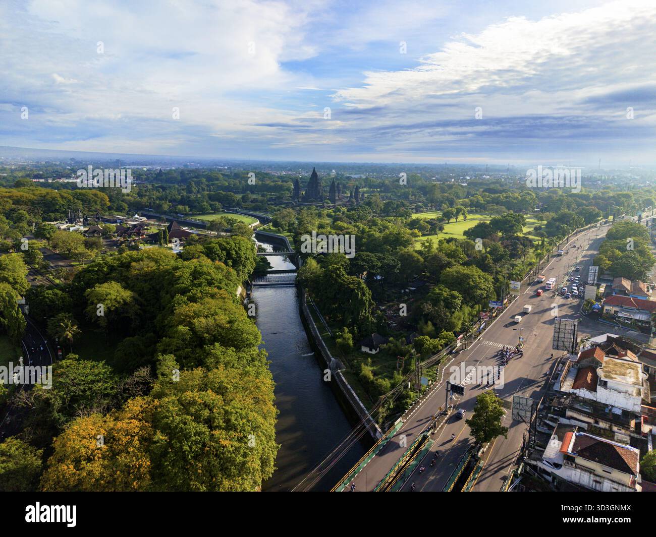 Aerial view of a river meandering through lush greenery alongside a ...