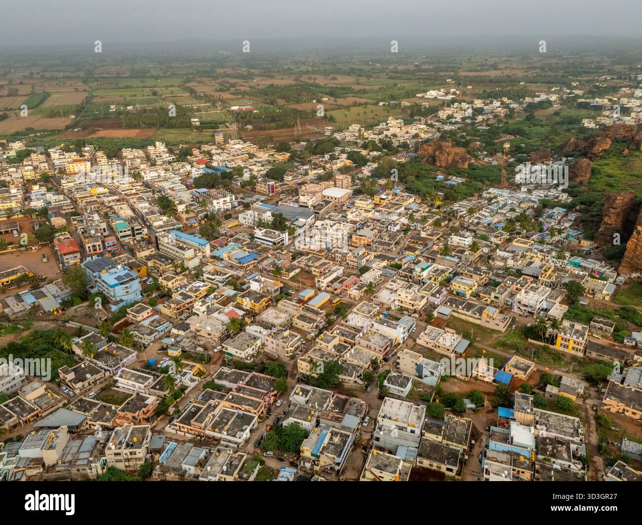 Aerial view of the town nestled amidst rugged terrain, with buildings ...
