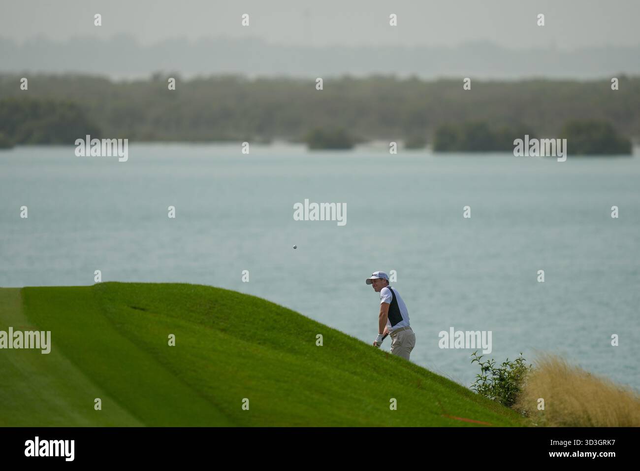 Calum Hill of Scotland hits a shot from a bunker on the 16th hole ...