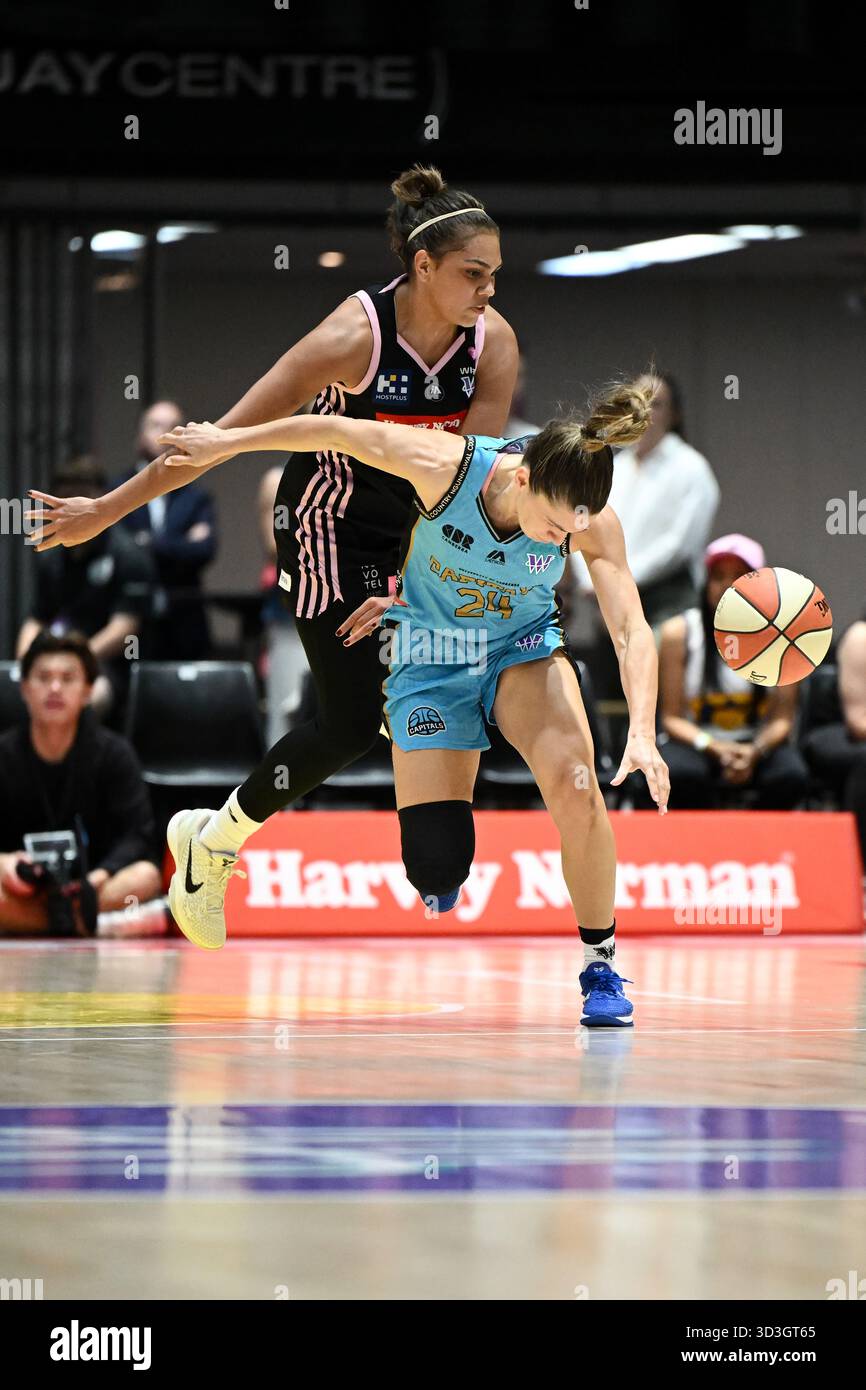 Shaneice Swain of the Flames and Isabella Brancatisano of the Capitals ...