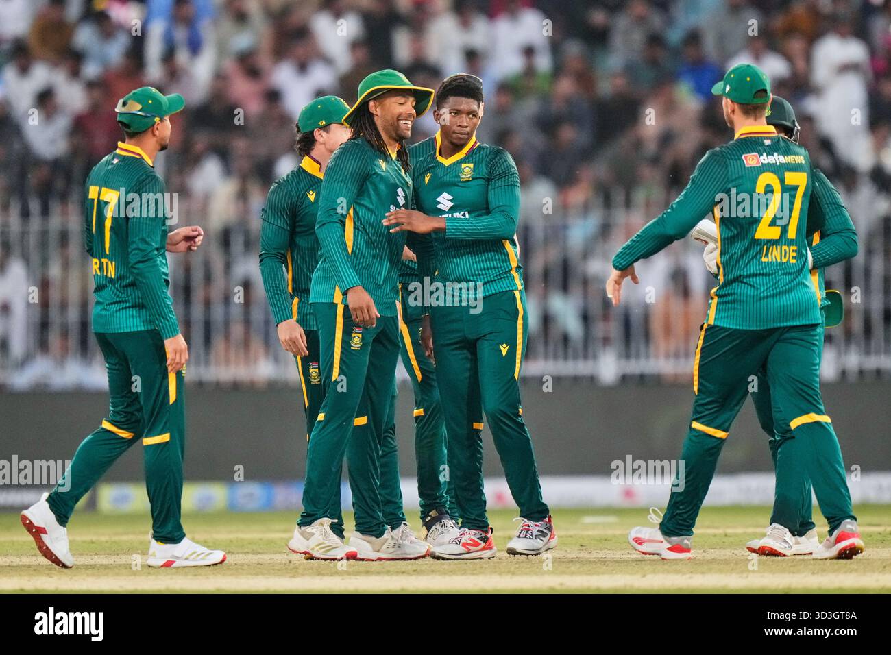 South Africa's Nqabayomzi Peter, center, celebrates with teammates ...