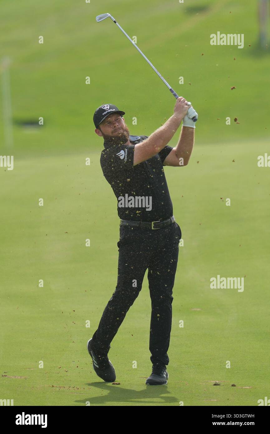 Tyrell Hatton of England plays his second shot on the 17th hole during ...