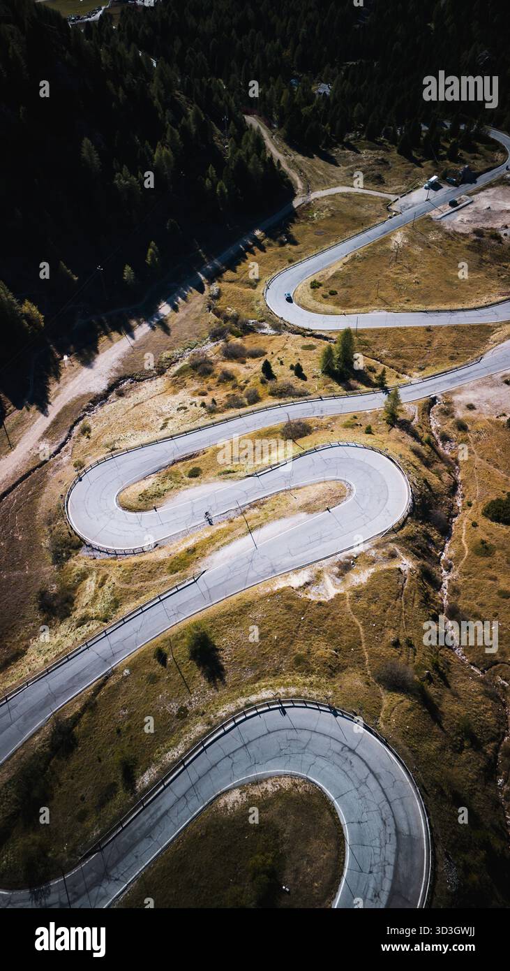 Aerial view of a winding road cutting through a landscape, the road's ...