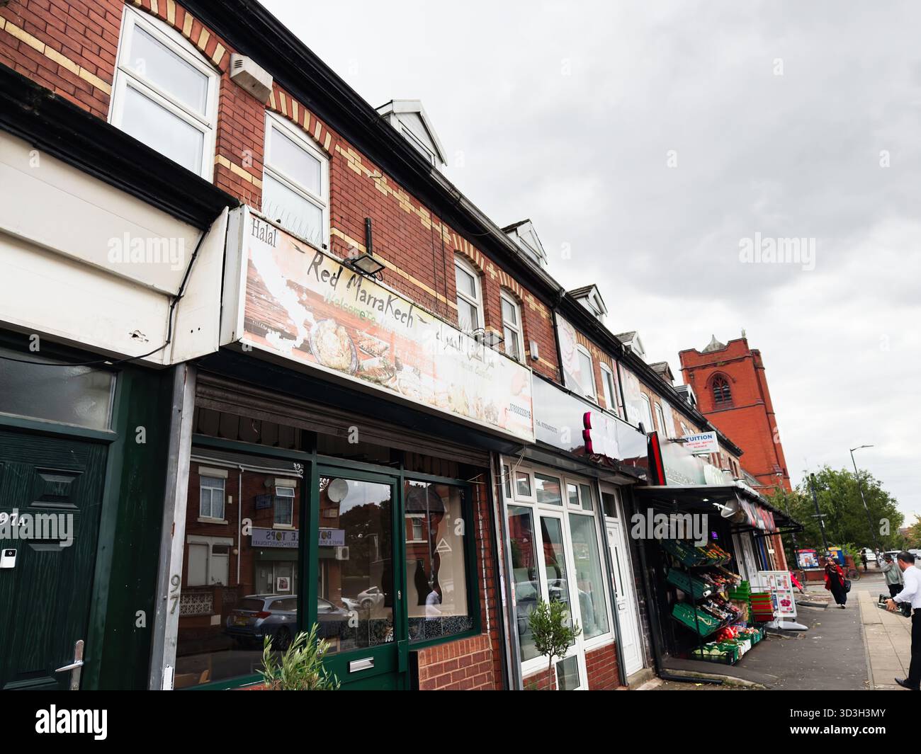 Manchester, UK - September 30, 2025: Row of brick storefronts in ...