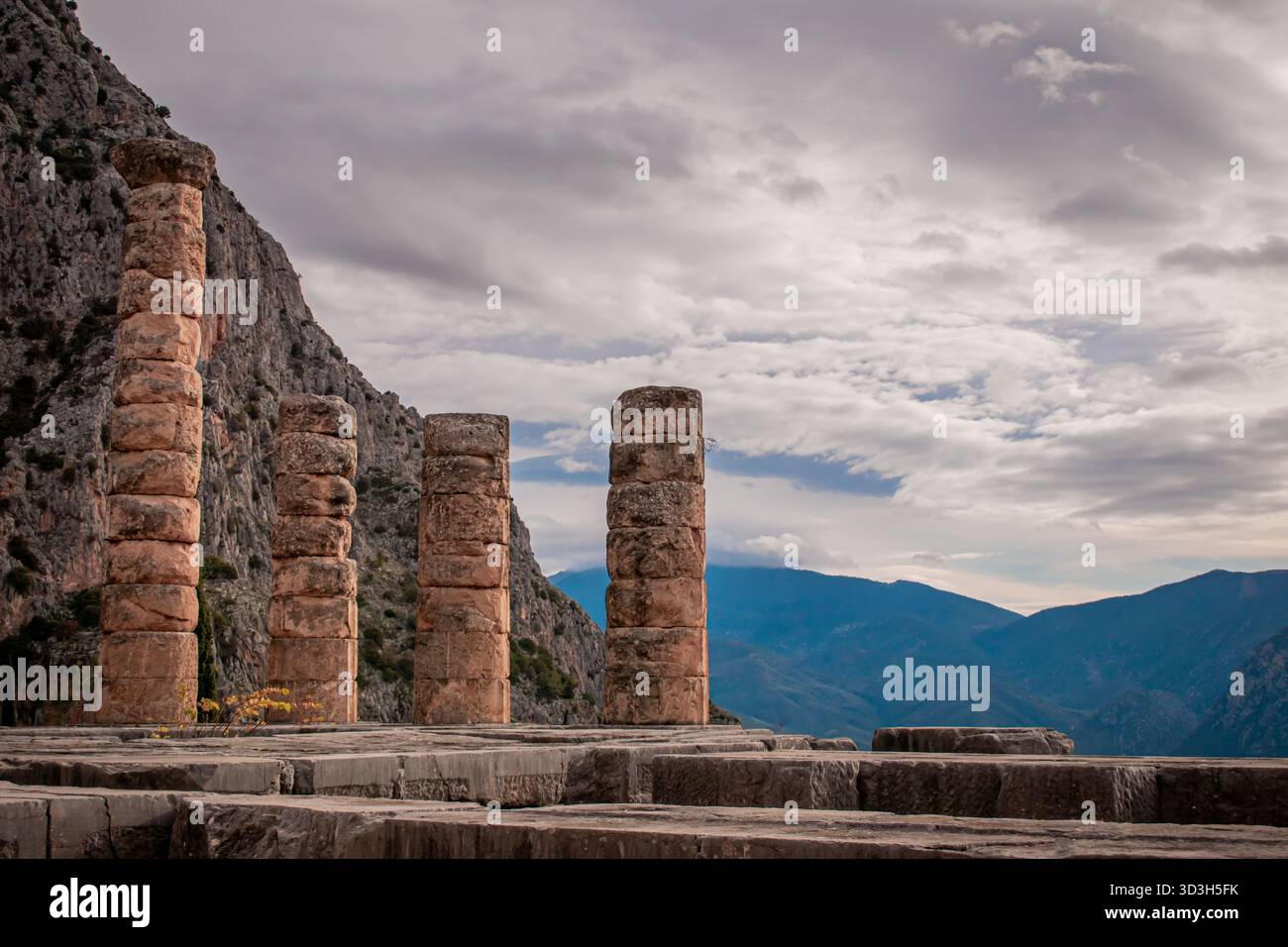 The columns that remain from the ancient temple in Delphi, on the steep ...