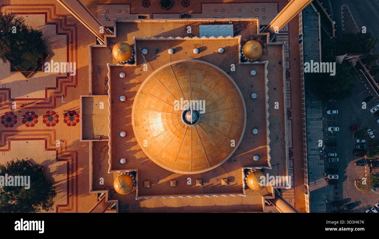Aerial view of the National Mosque's golden dome reflecting the soft ...