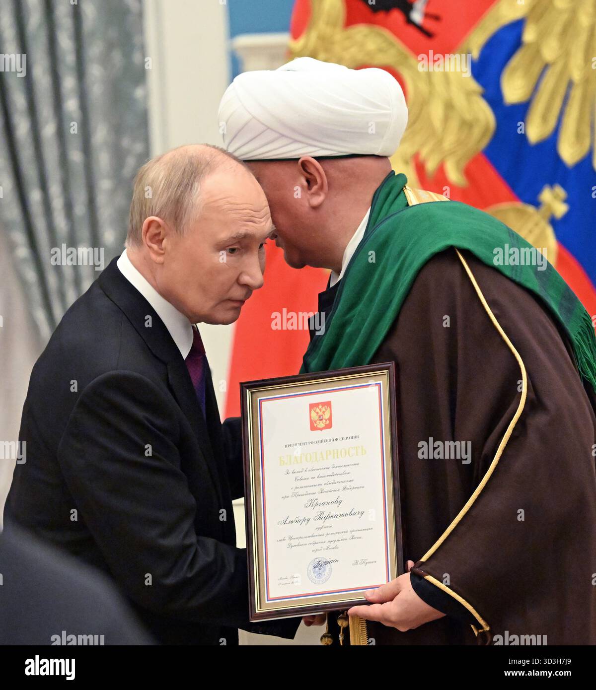 Russian President Vladimir Putin (left) and the head of the Spiritual ...