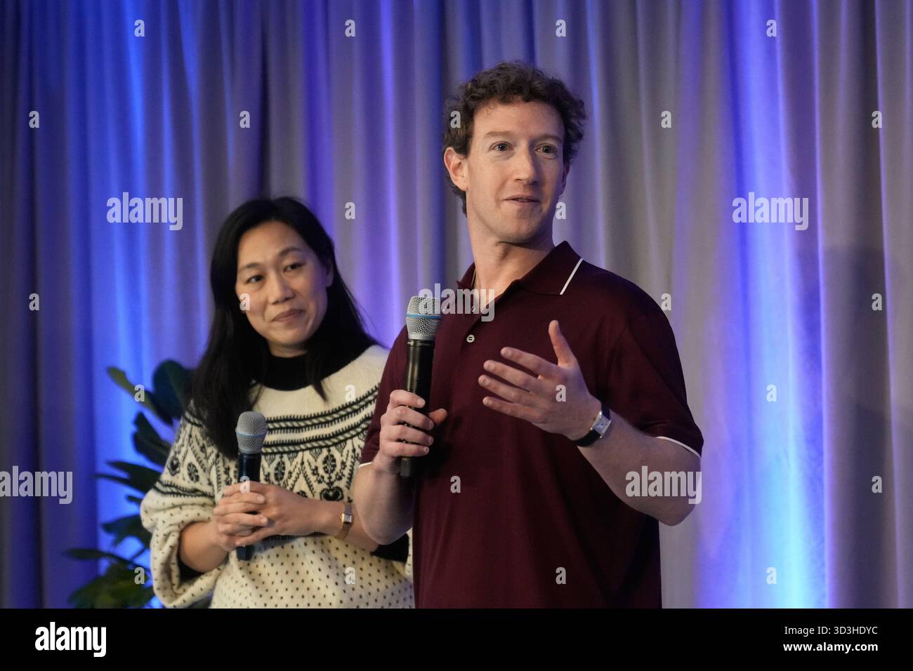 Meta CEO Mark Zuckerberg, right, speaks next to his wife, Priscilla ...