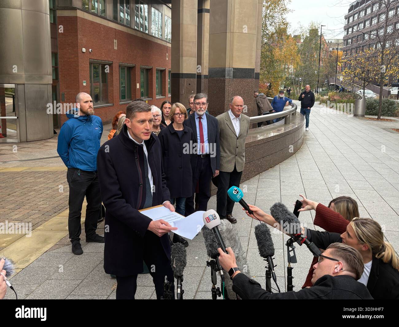 Widow Bryony Marriott (third right) listens as DCI Andy Knowles makes a ...