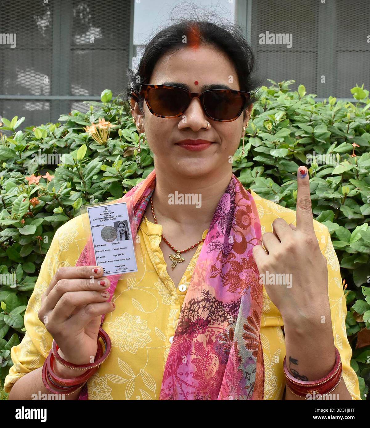 PATNA, INDIA - NOVEMBER 6: A voter showing ink marks after cast her ...