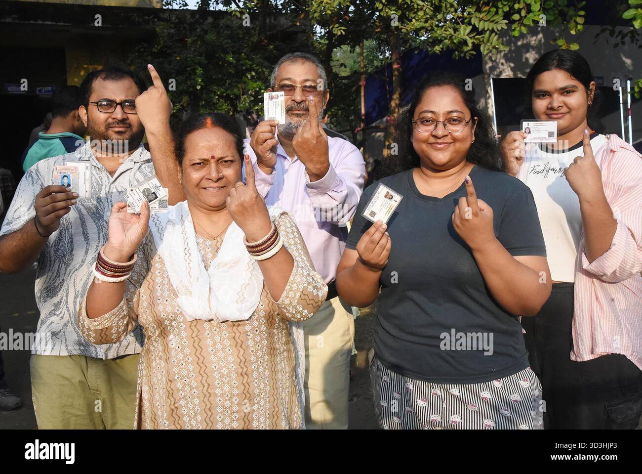 PATNA, INDIA - NOVEMBER 6: Voters showing ink marks after cast their ...