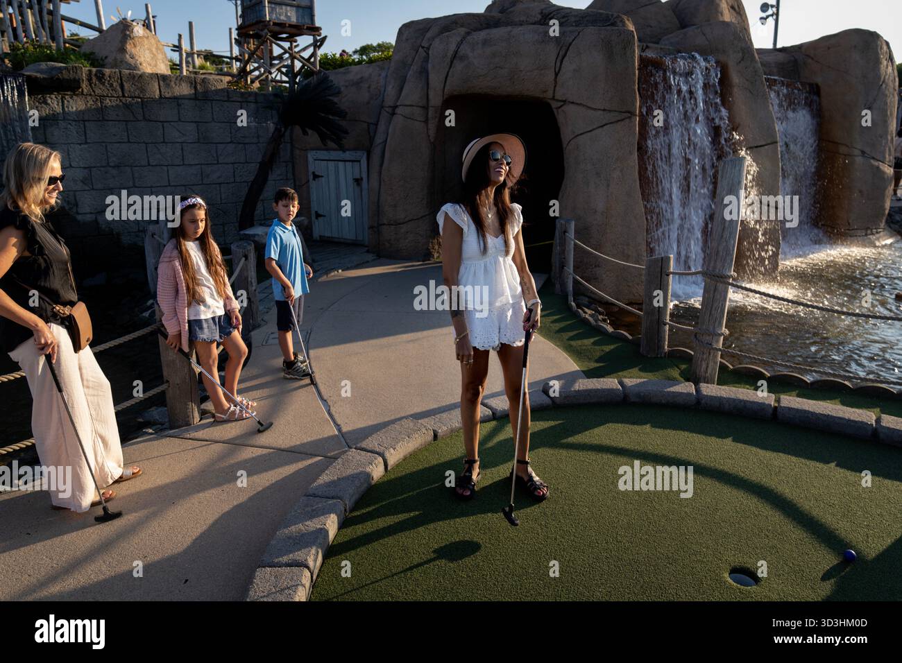 Ruth Wilson, who has lupus, reacts after missing a putt while playing ...