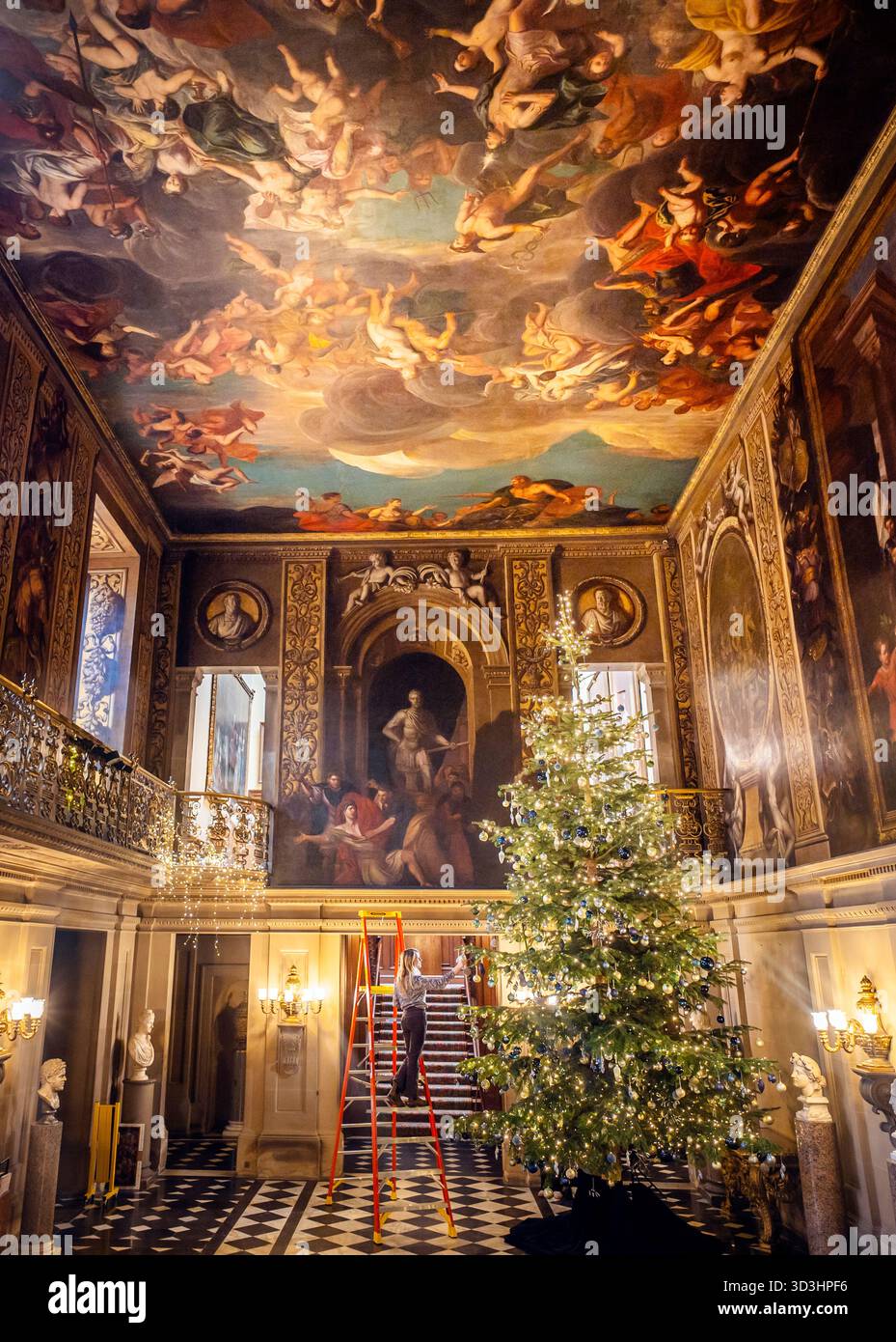 Olivia Housley puts the finishing touches to a Christmas tree in the ...