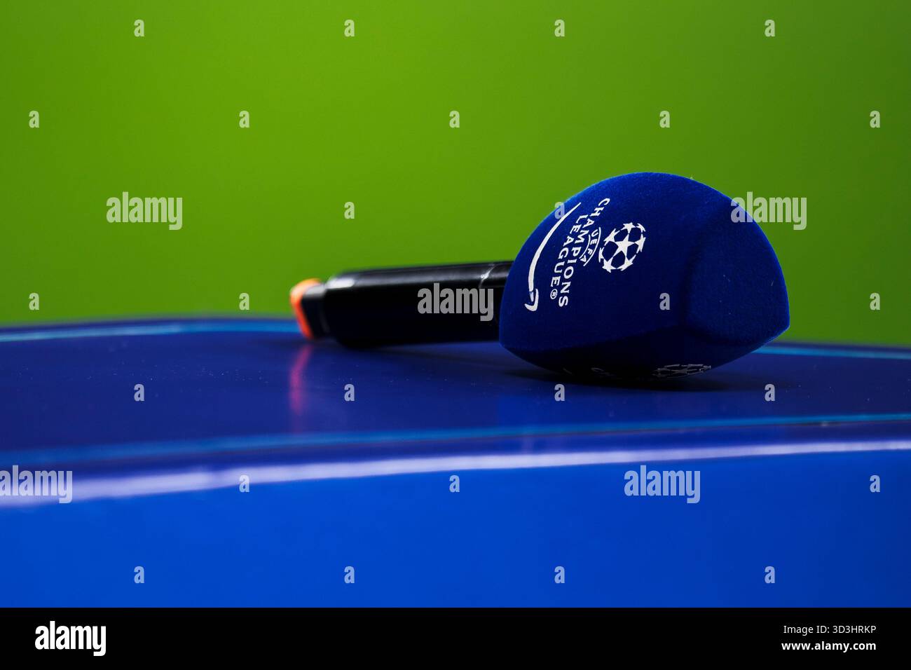 A microphone beragin logos of UEFA Champions League and Amazon Prime is ...