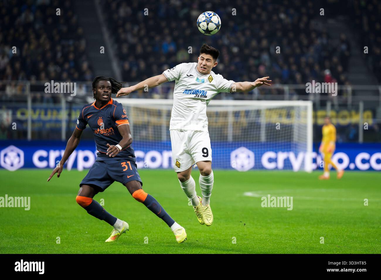 Dastan Satpayev of FC Kairat Almaty competes for the ball with Yann ...