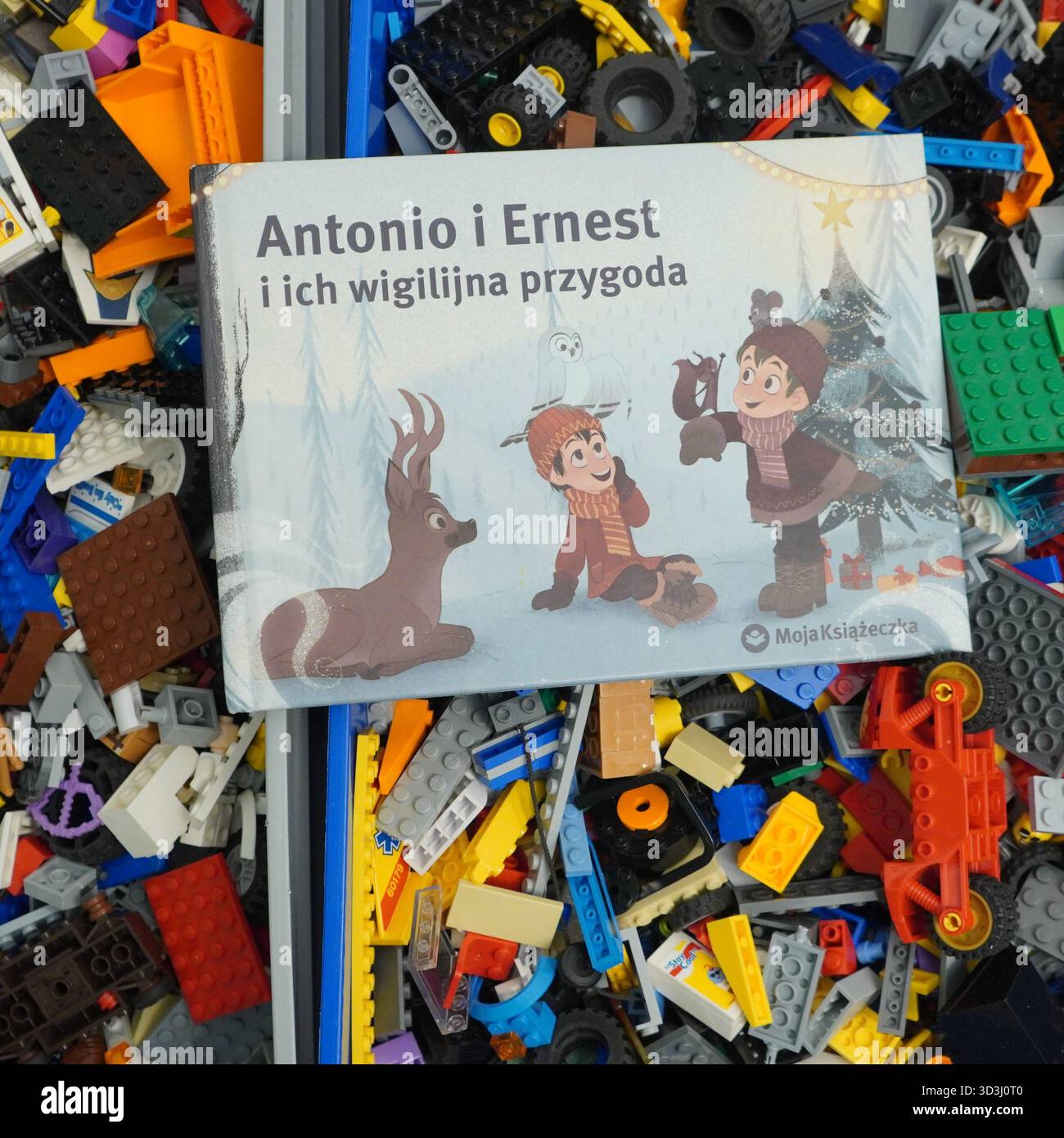 A book laying on Lego bricks Stock Photo - Alamy