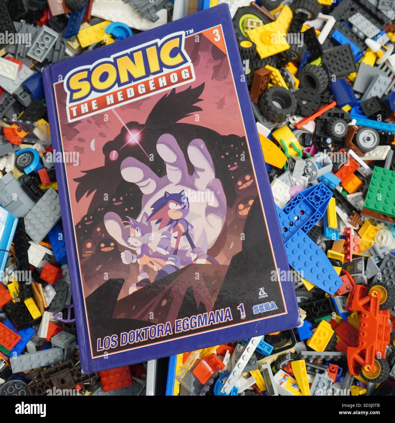 A book laying on Lego bricks Stock Photo - Alamy