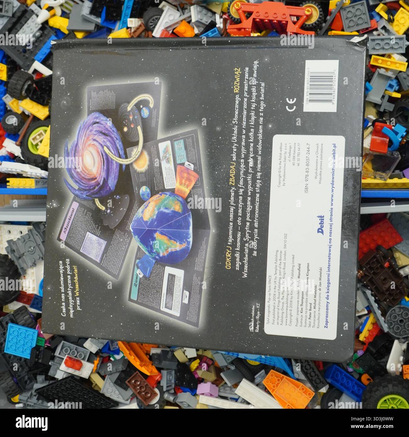 A book laying on Lego bricks Stock Photo - Alamy