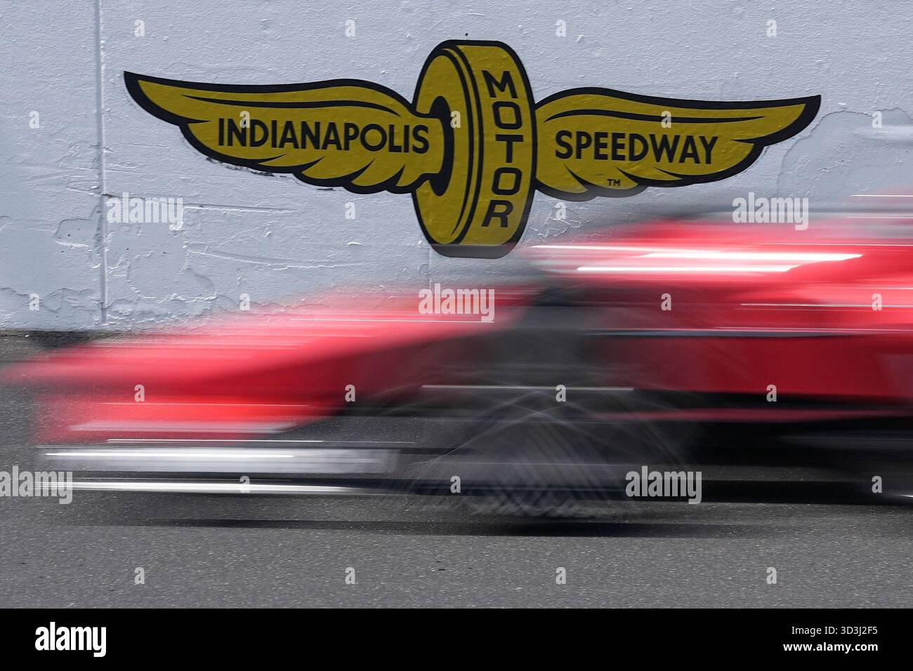 FILE - A car goes by the Indianapolis Motor Speedway logo during ...