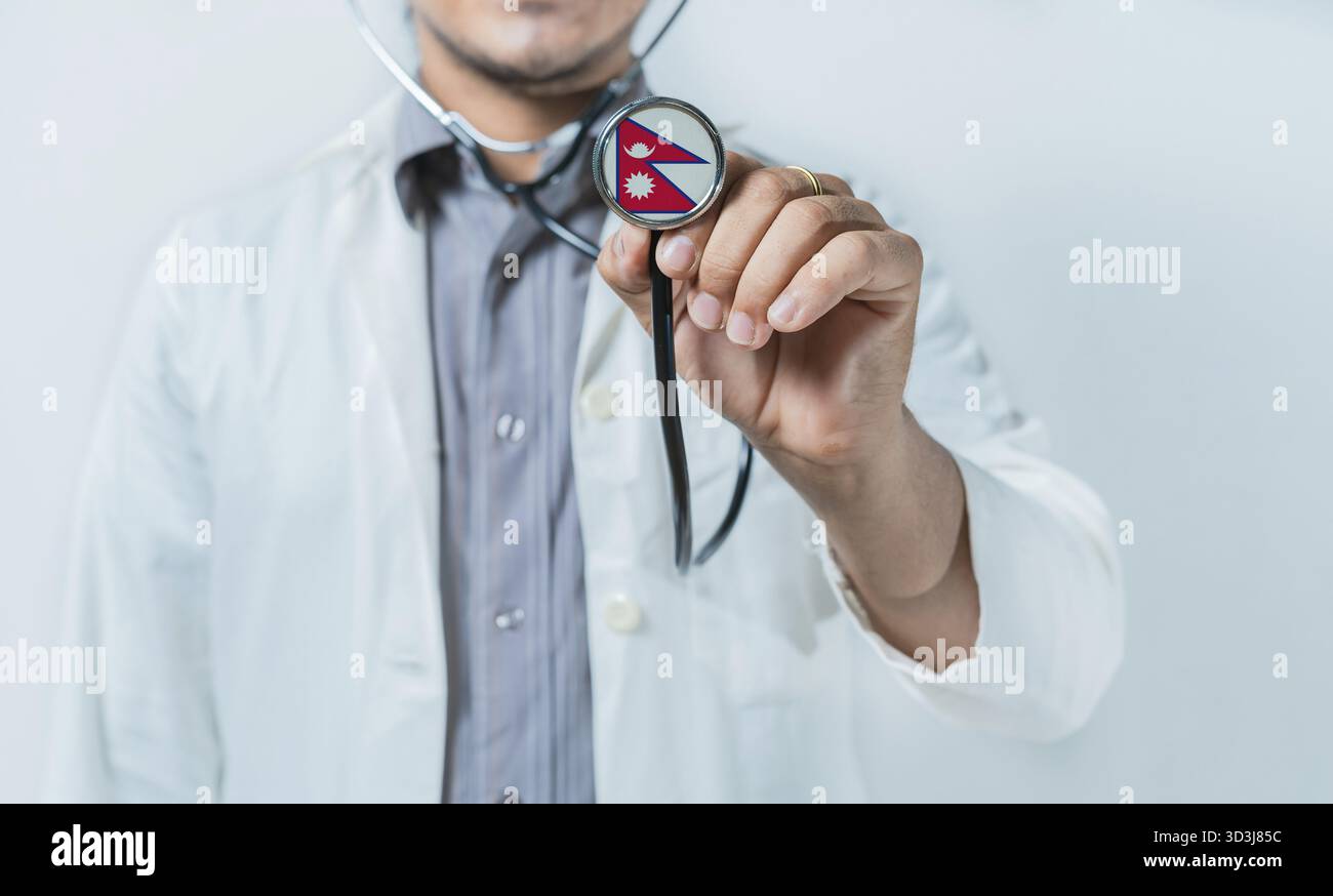 Nepal national healthcare. Doctor showing stethoscope with Nepal flag ...