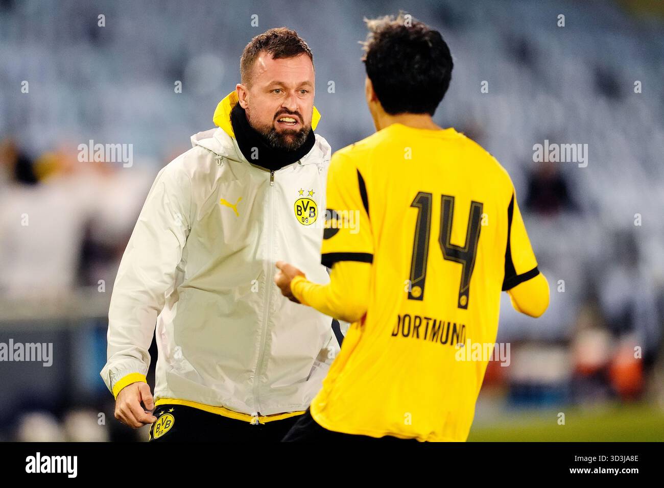 Borussia Dortmund head coach Felix Hirschnagl (left) and Borussia ...