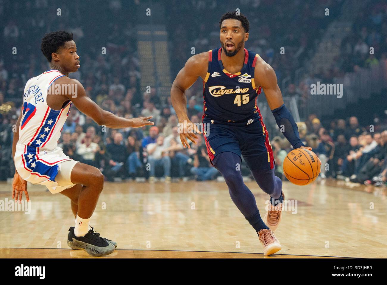 Cleveland Cavaliers' Donovan Mitchell (45) drives past Philadelphia ...