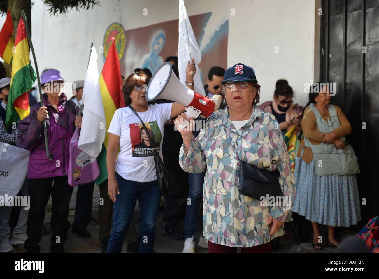 A supporter of former Bolivian president Jeanine Añez waits outside the ...
