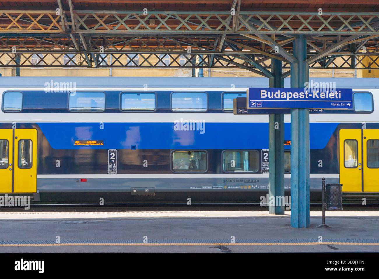 Double-deck MAV train at Eastern Railway Station platform, blue-yellow ...