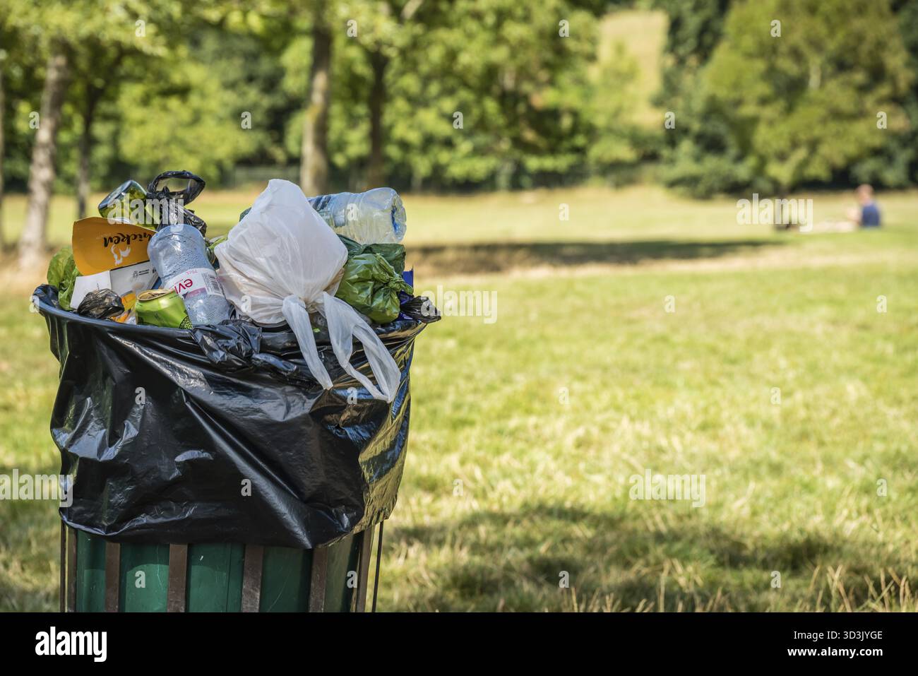 London, UK - July 2020 : Overflowing large rubbish and litter garbage ...