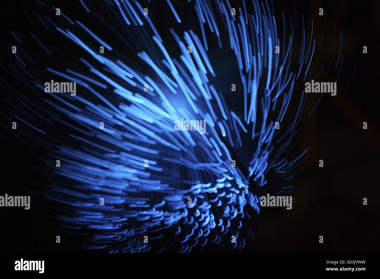 Blue abstract particles and lines with bokeh and blur in dark ...