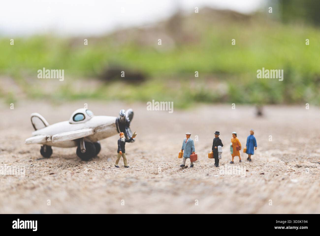 Miniature people : Travellers hloding Carry-on luggage get on the plane ...