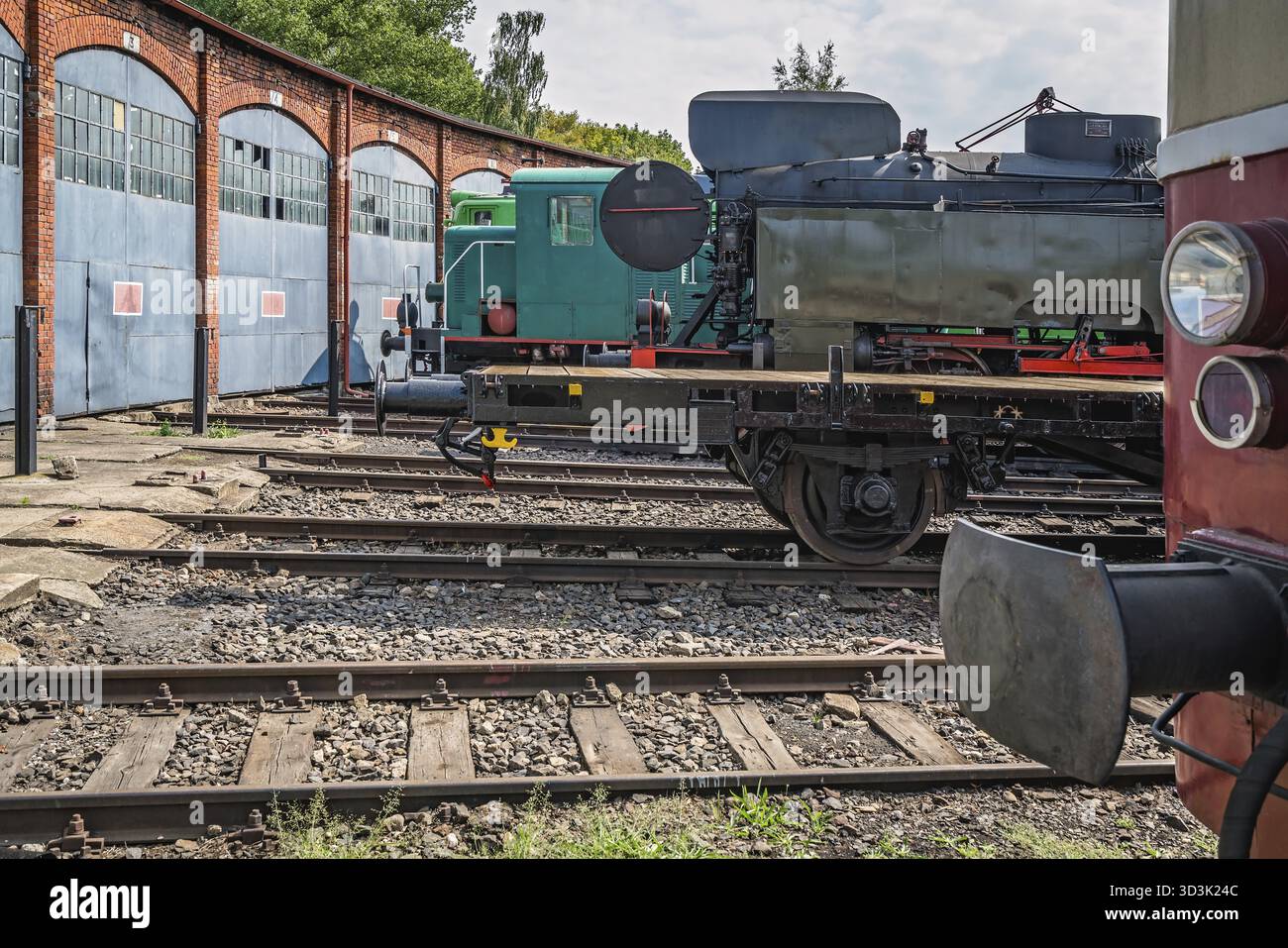 Old disused retro train locomotives on the side tracks in the depot in ...