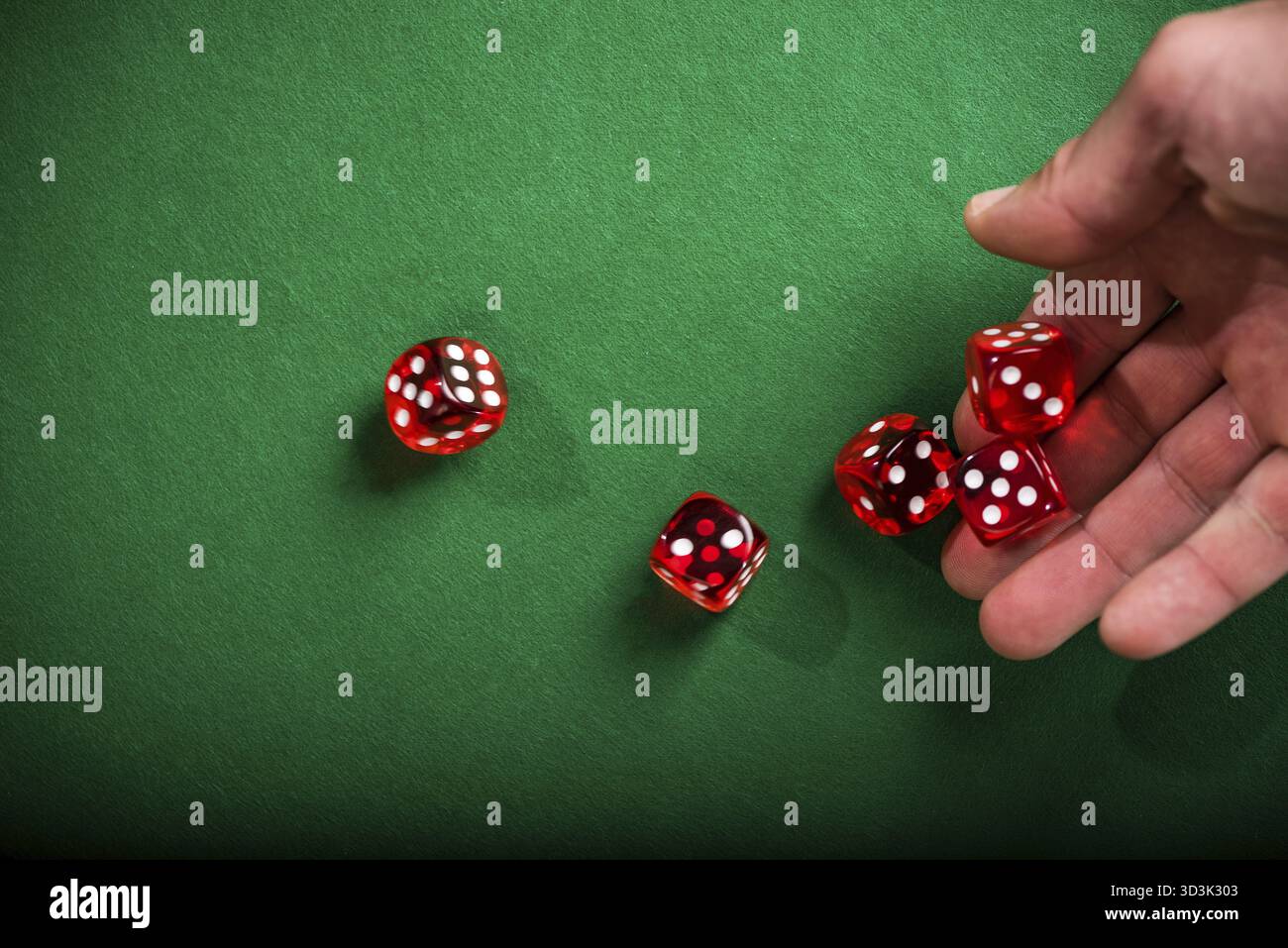 Red dice in hand hi-res stock photography and images - Alamy