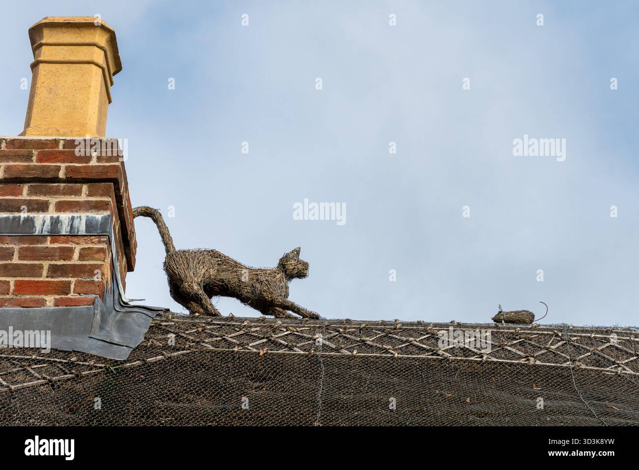 Cat and mouse straw finials on a thatched cottage roof, straw finial ...