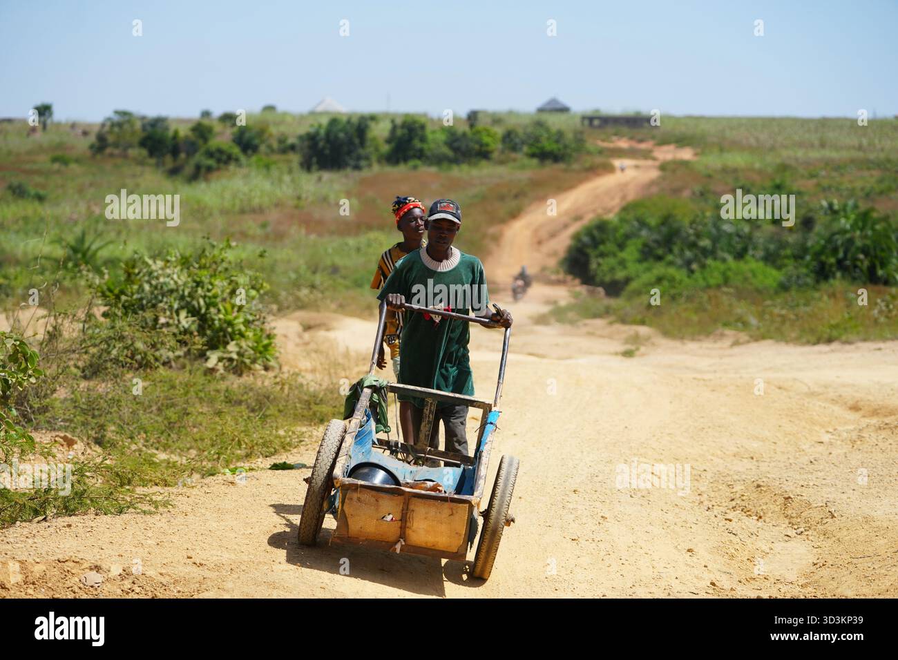 A man pushes a cart on a dirt road in Gonin Gora, Nigeria, Thursday ...