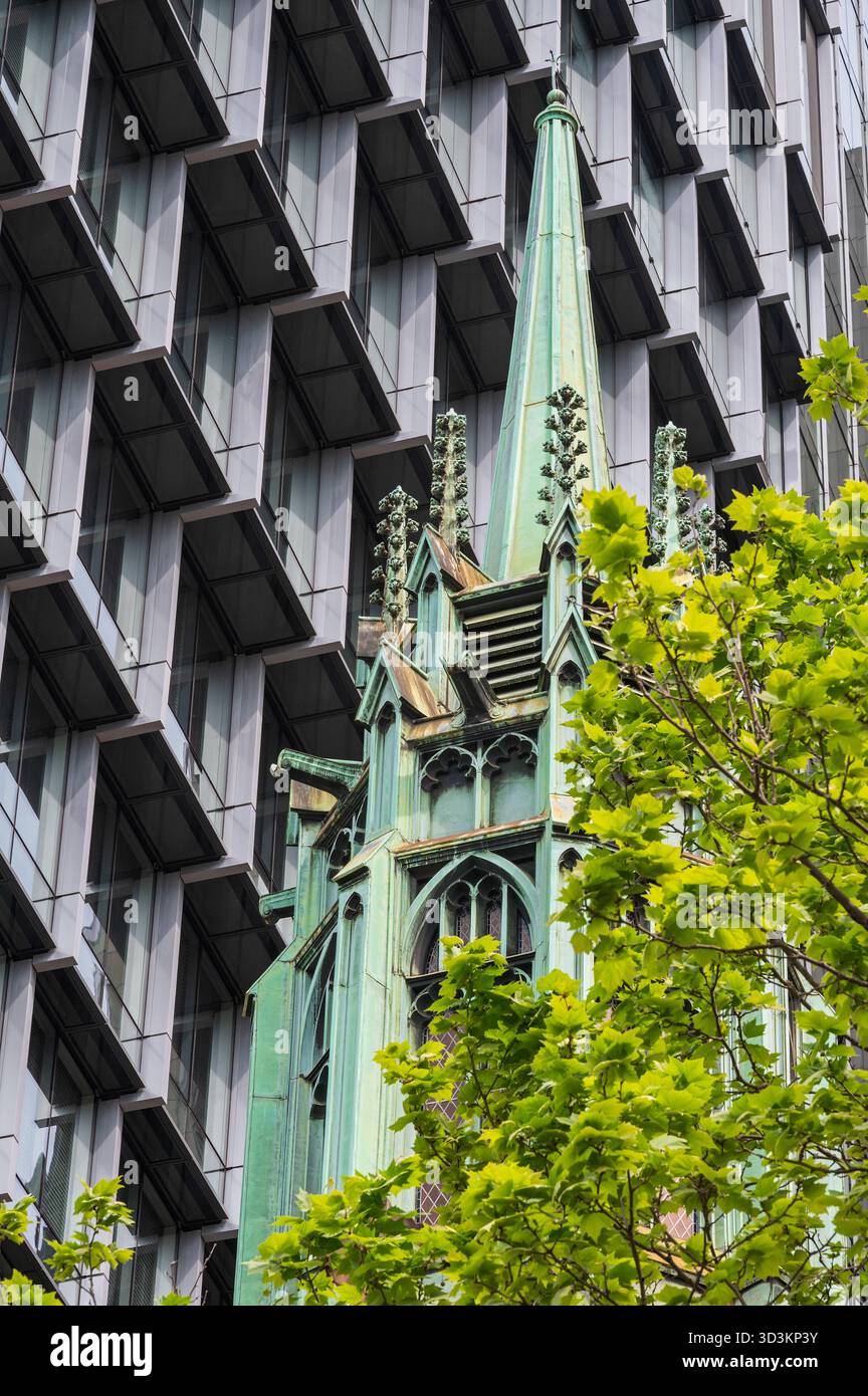 The architectural contrast of the spire of St Stephens church against a ...