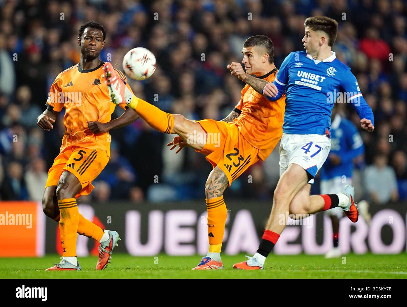 Roma's Evan Ndicka, Gianluca Mancini, and Rangers' Mikey Moore battle ...
