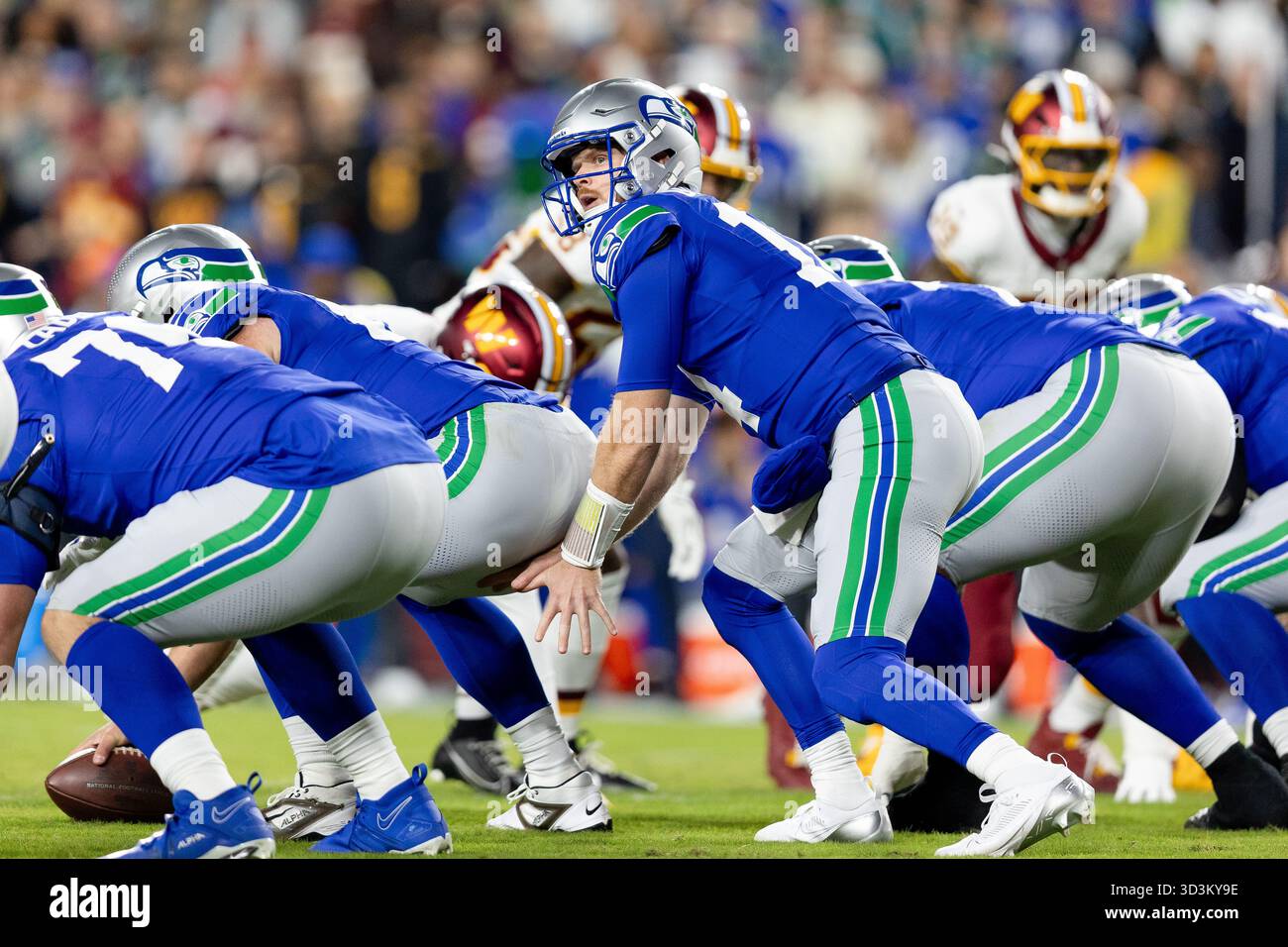 Seattle Seahawks quarterback Sam Darnold (14) calls for the snap of the ...