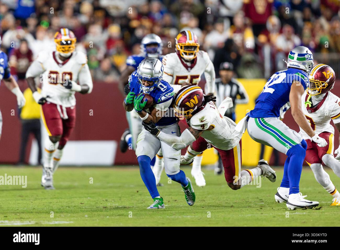 Washington Commanders linebacker Frankie Luvu (4) makes the tackle ...