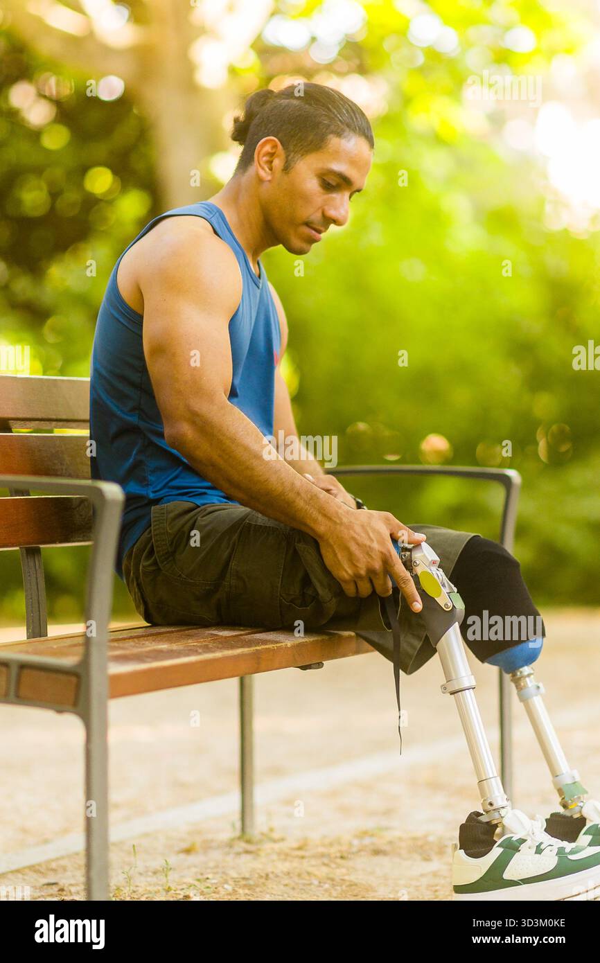 Disabled athlete adjusting prosthetic hi-res stock photography and ...