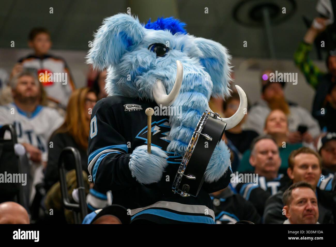 Utah Mammoth mascot Tusky bangs the drum during the third period of an ...
