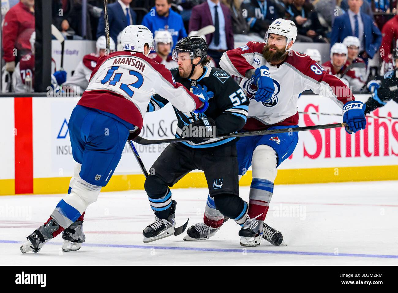 Utah Mammoth left wing Michael Carcone (53) is checked by Colorado ...