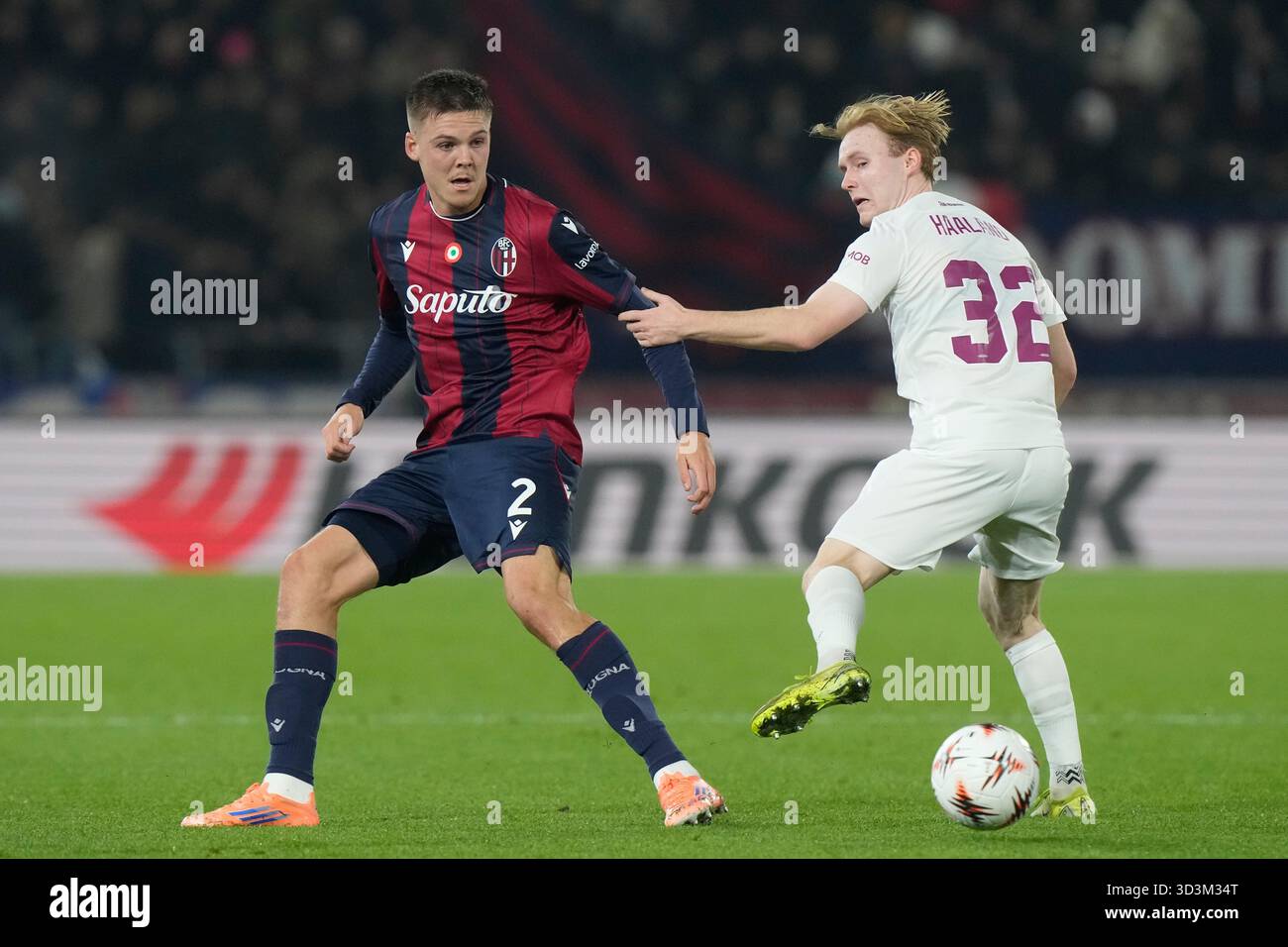 Bologna's Emil Holm, left, and Brann's Markus Haaland fight for the ...