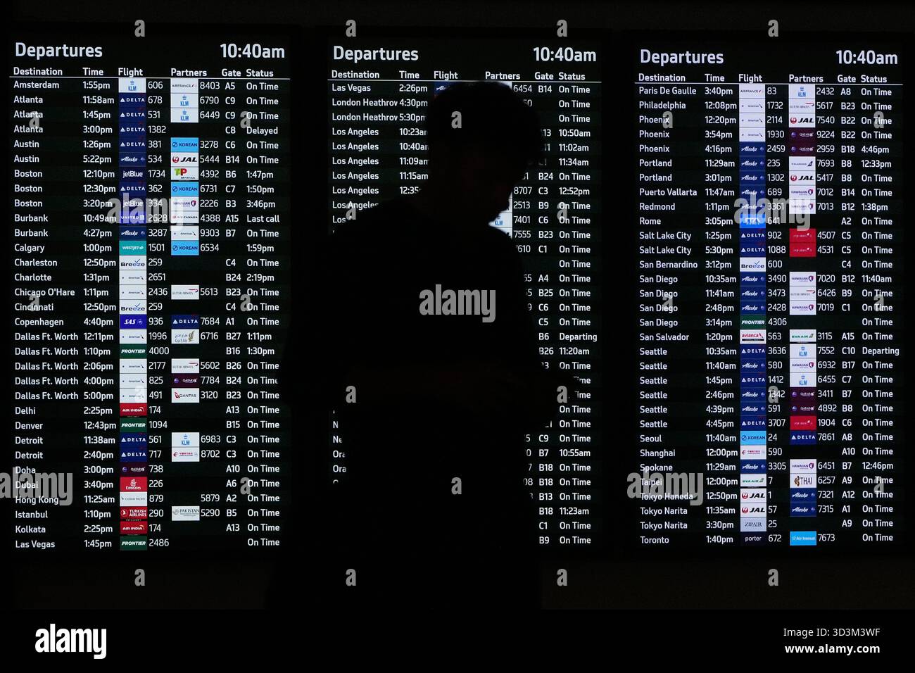 A traveler using TSA Pre-Check waits in a security line at a San ...
