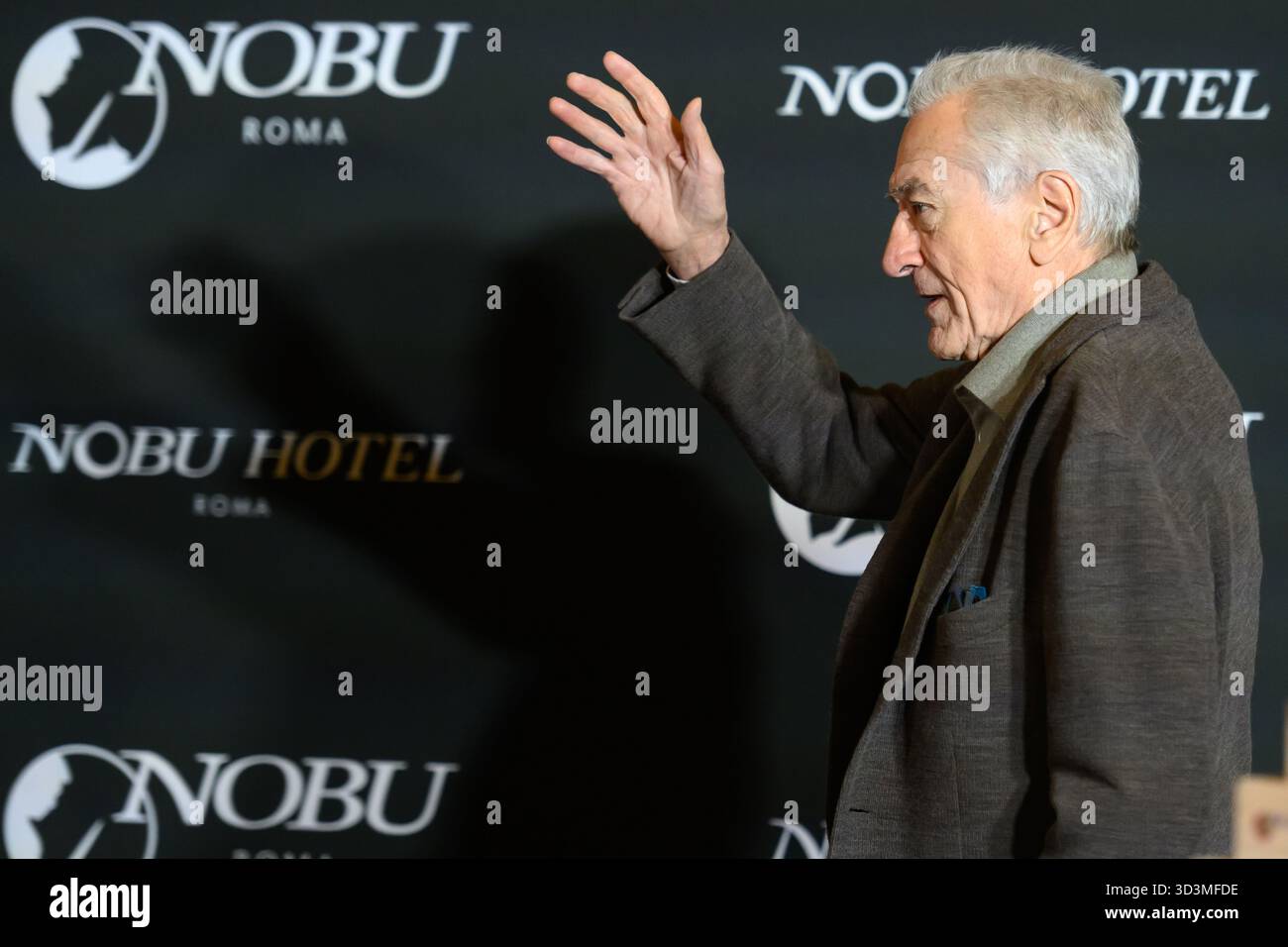 Actor Robert De Niro waves as he arrives for the opening of the Nobu ...