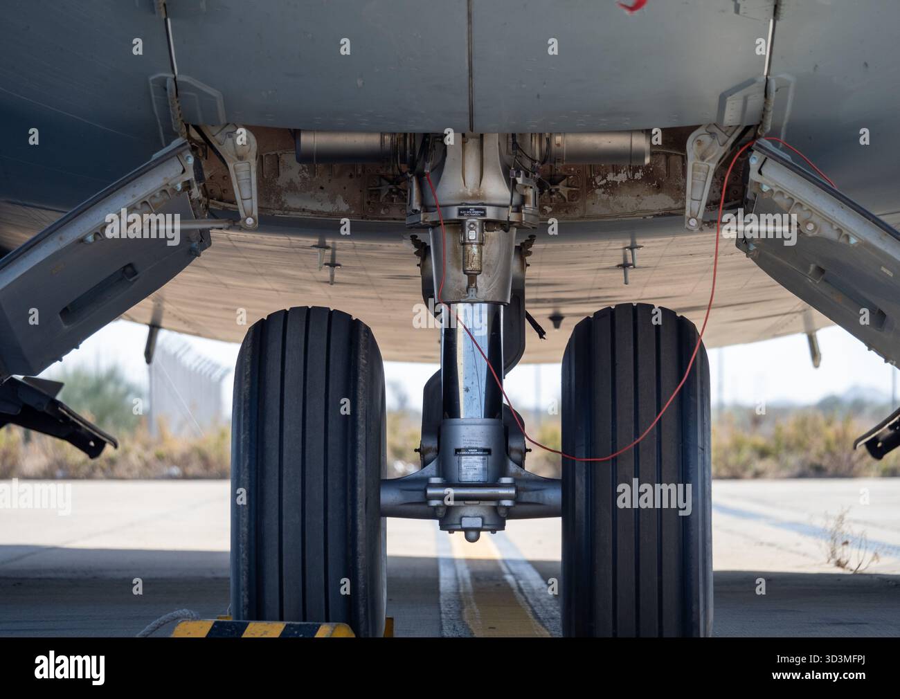 Aircraft nose landing gear under fuselage with open bay doors Stock ...