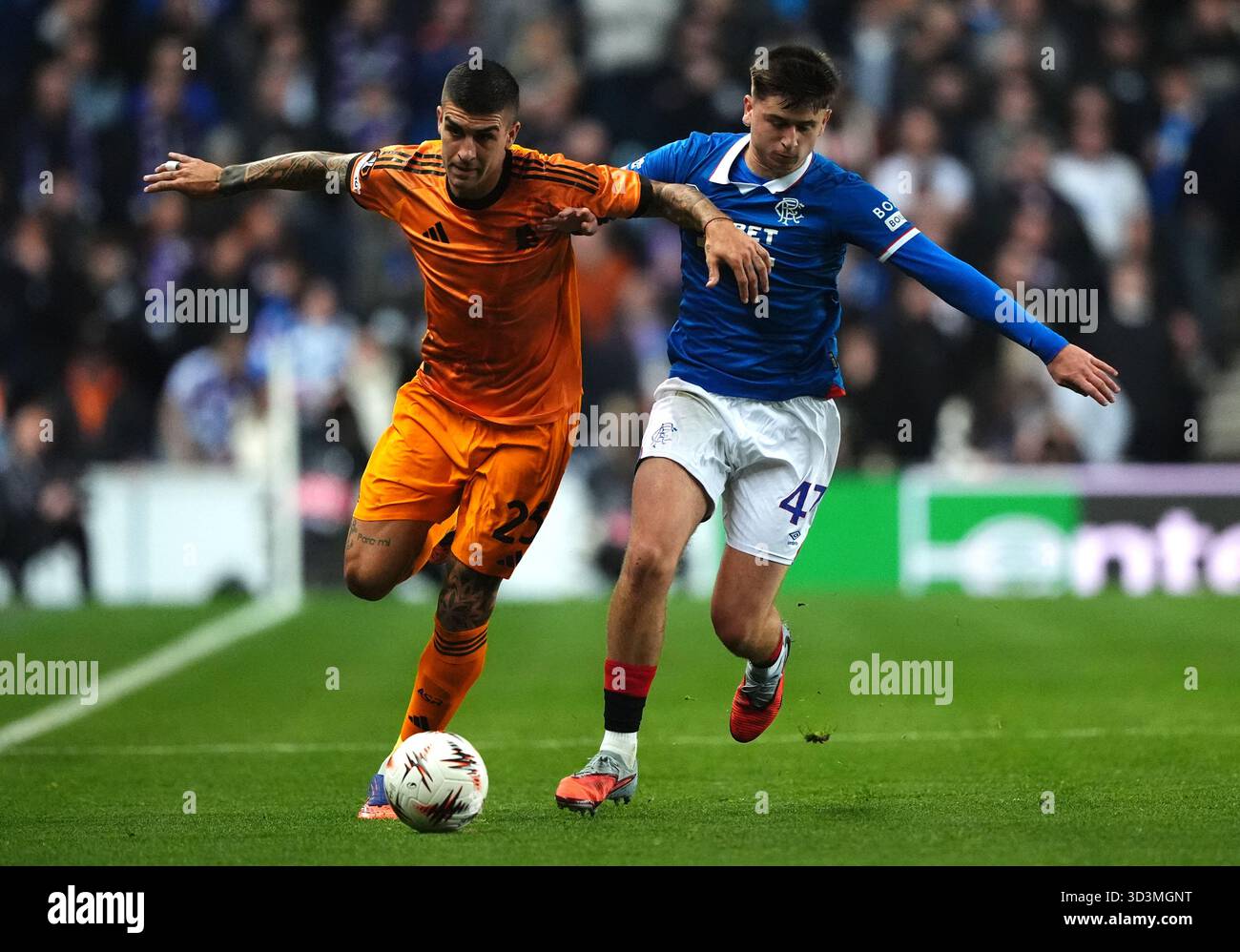 Roma's Gianluca Mancini (left) and Rangers' Mikey Moore battle for the ...